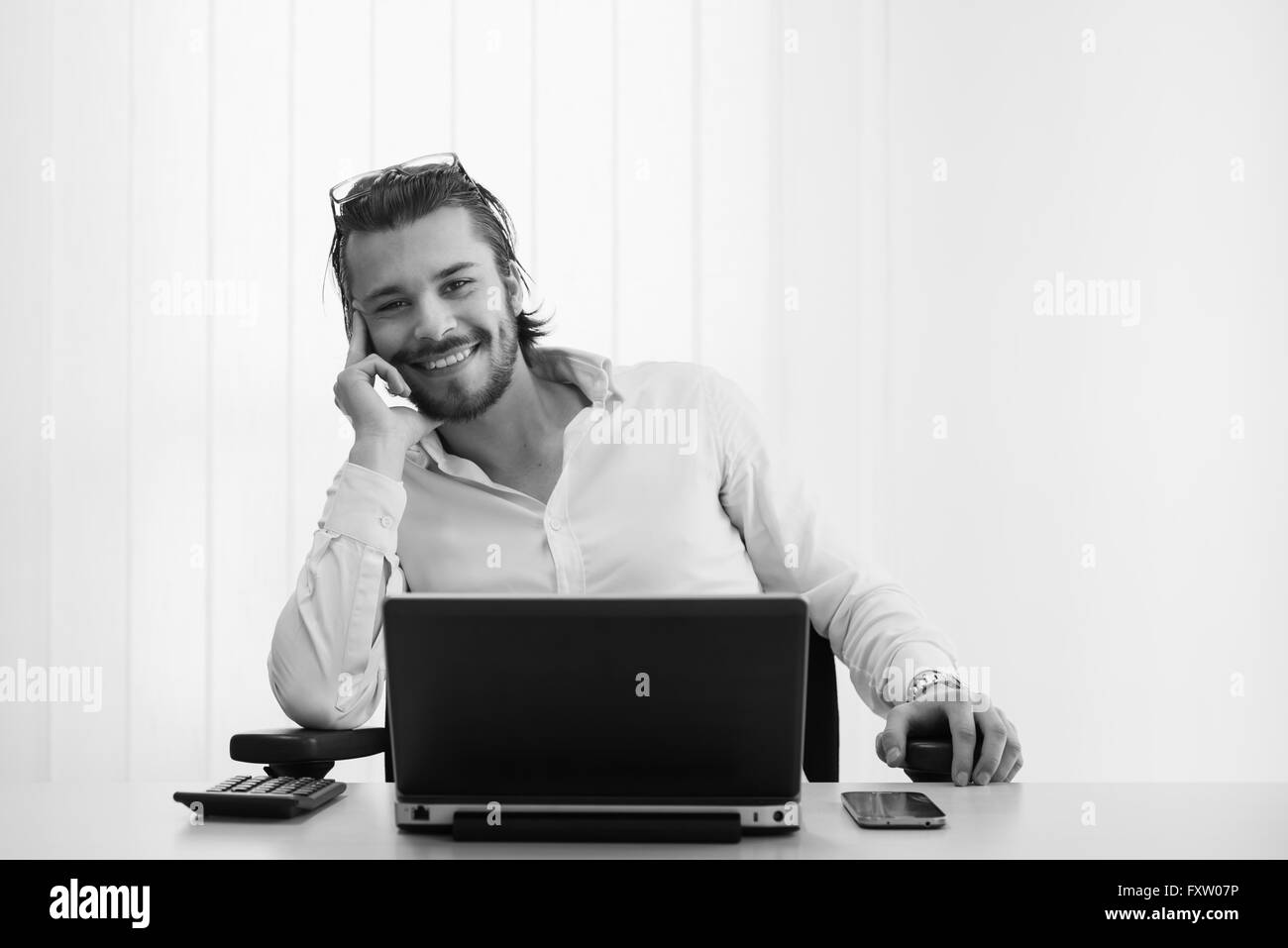 young business man smiling, office, work Stock Photo - Alamy