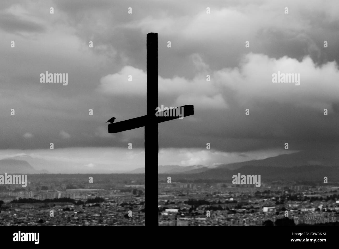 A wooden cross, pointing out a local church, is seen placed above the ...
