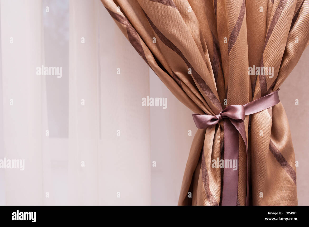 beautiful golden curtain in the bedroom interior Stock Photo - Alamy