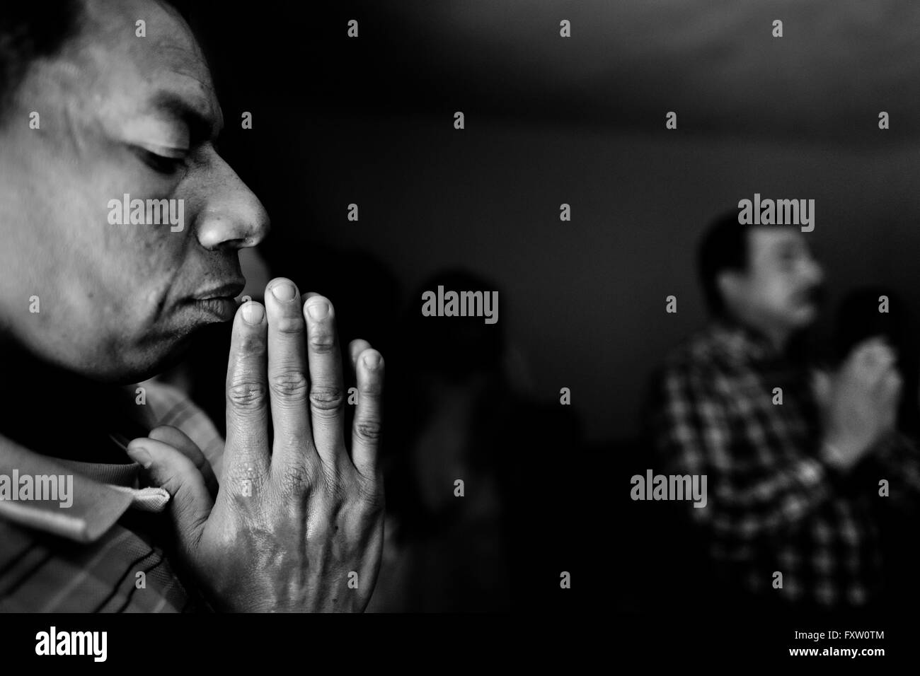 Colombian believers pray during the religious healing ceremony ...
