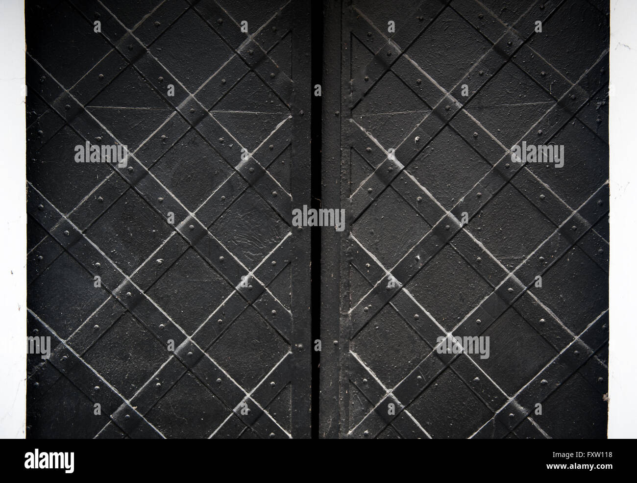 texture of black old metal door with rivets for background Stock Photo ...