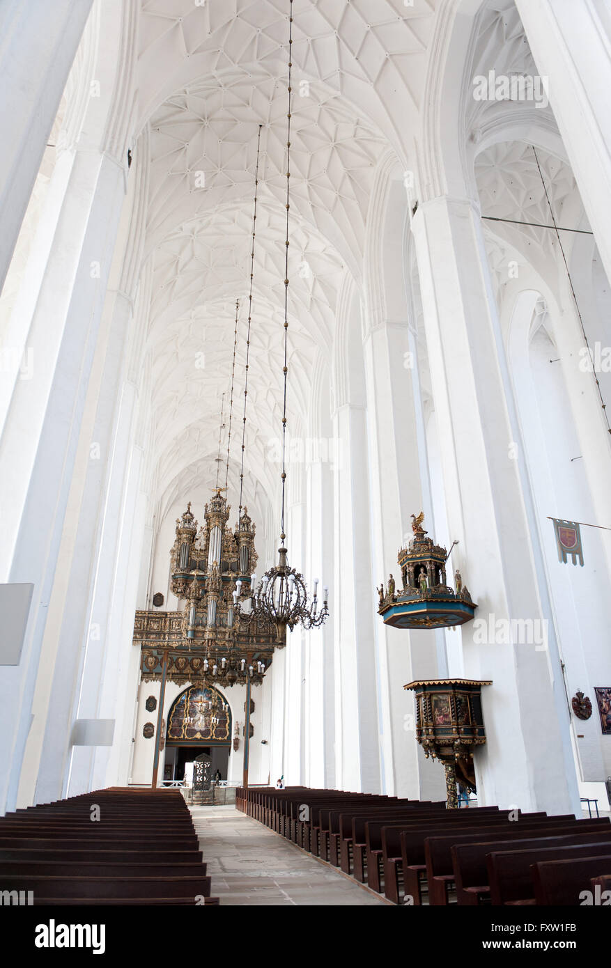 Organ and arcade in nave with pulpit and pews rows of Kosciol Mariacki ...