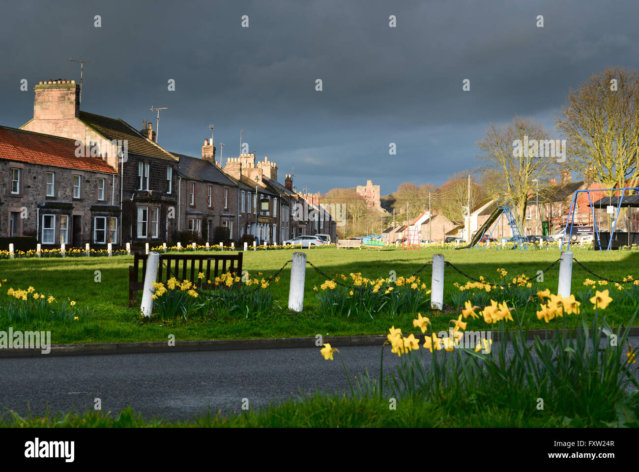 Norham village green, looking towards the Castle Stock Photo - Alamy