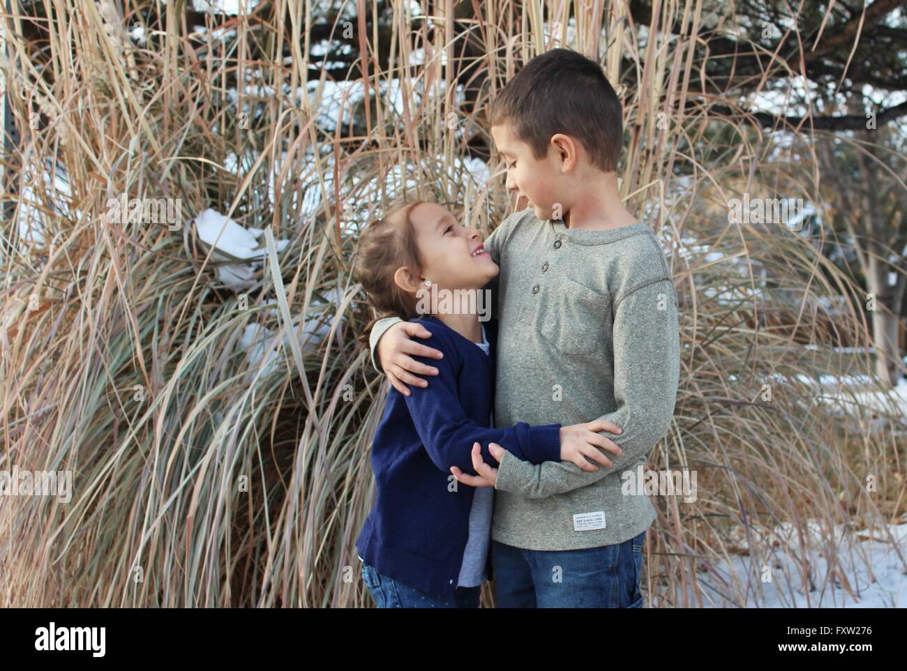 Children hugging hi-res stock photography and images - Alamy