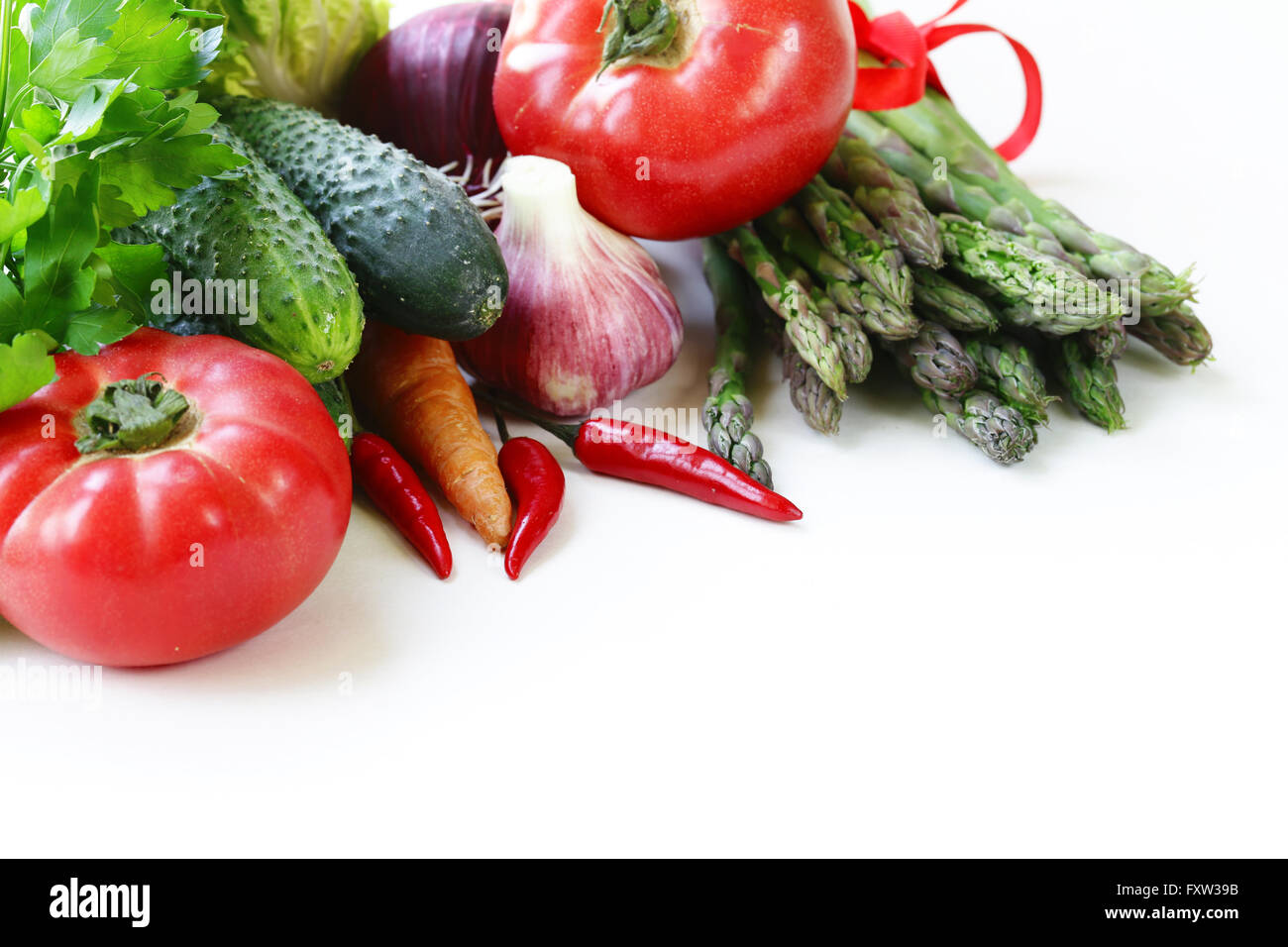 Various spring vegetables (asparagus, carrots, garlic, tomatoes ...
