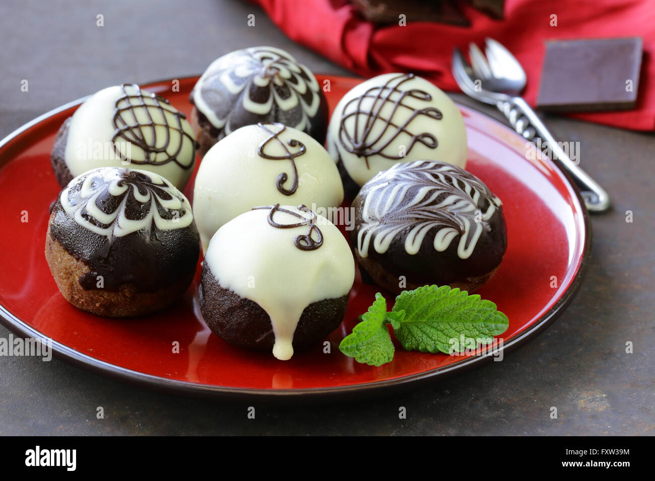 dessert biscuit balls cakes with chocolate icing Stock Photo - Alamy