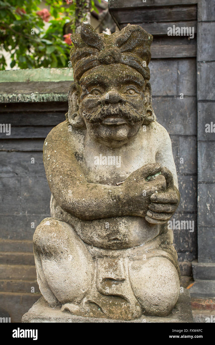 Traditional guard statue carved in stone on Bali, Indonesia Stock Photo ...
