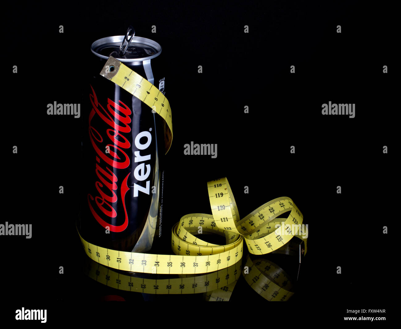 Low calorie sugar free Coca cola on black with tape measure Stock Photo ...