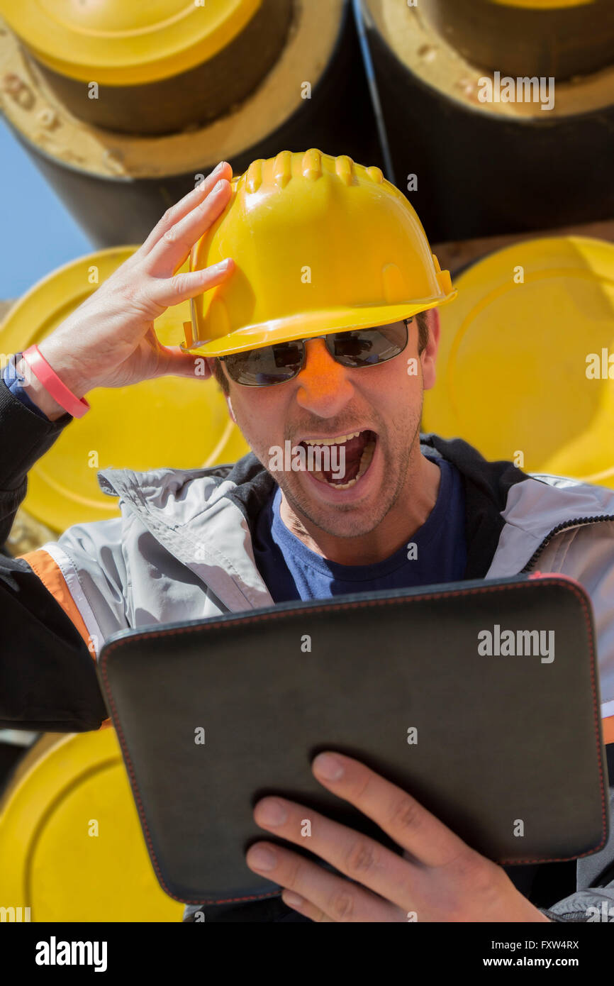 Builder under stress Stock Photo - Alamy