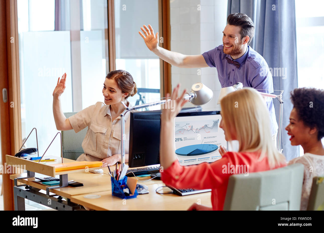 Business team waving hands office hi-res stock photography and images ...