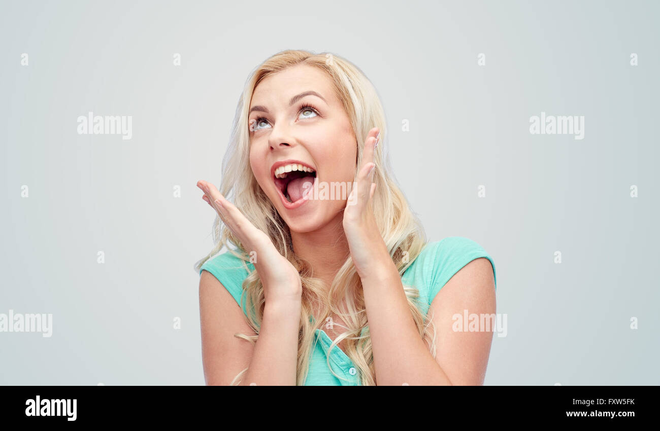 surprised smiling young woman or teenage girl Stock Photo - Alamy