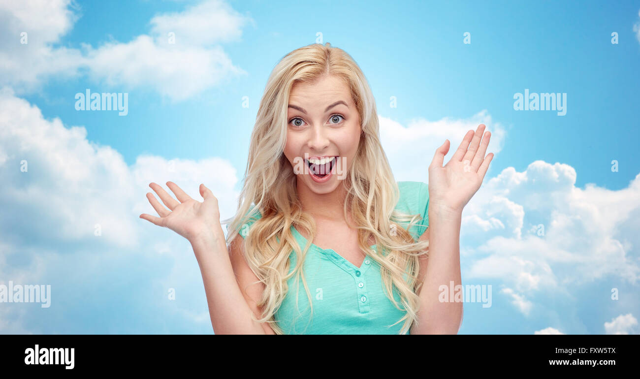 surprised smiling young woman or teenage girl Stock Photo - Alamy