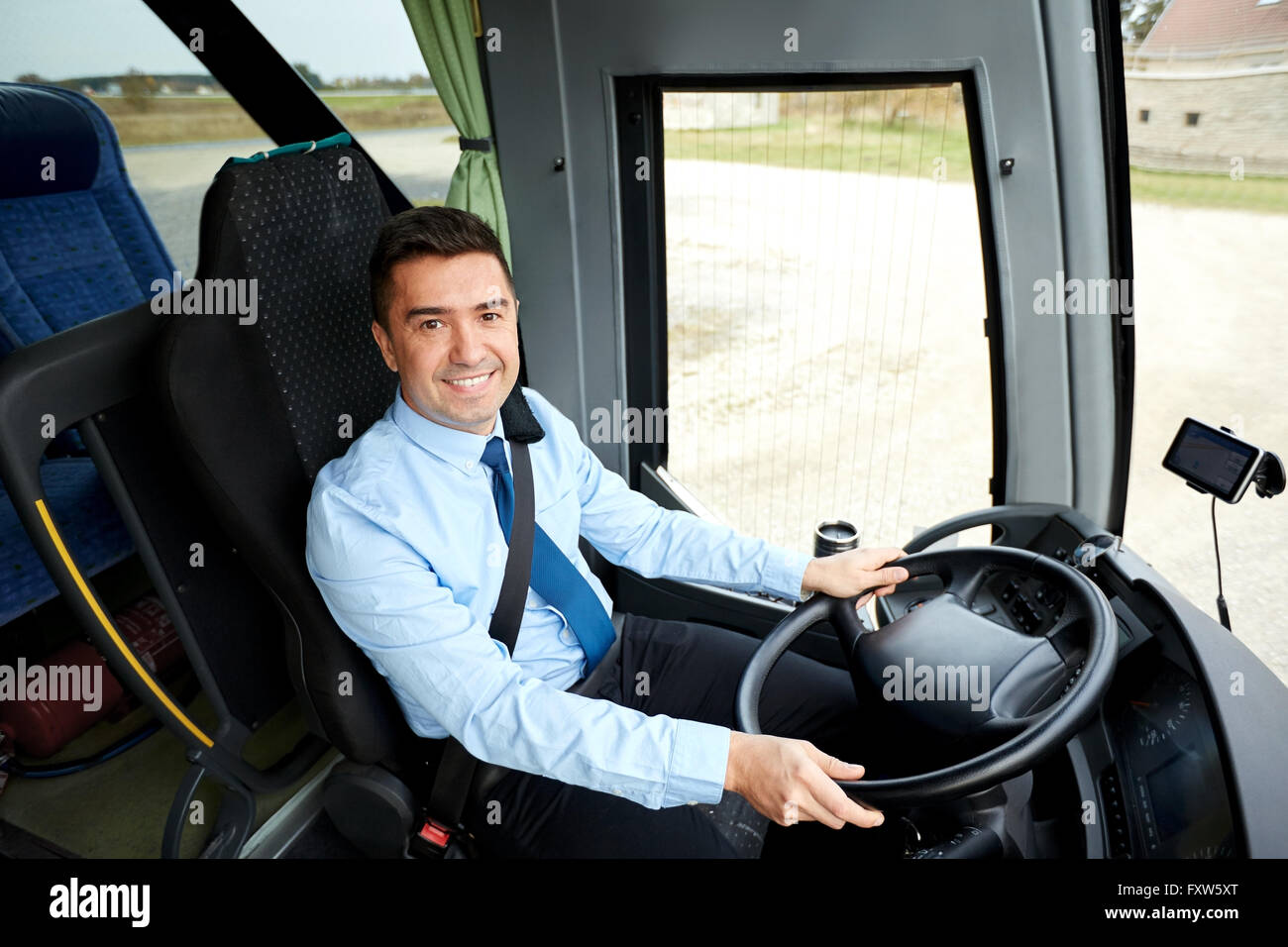 happy driver driving intercity bus Stock Photo - Alamy