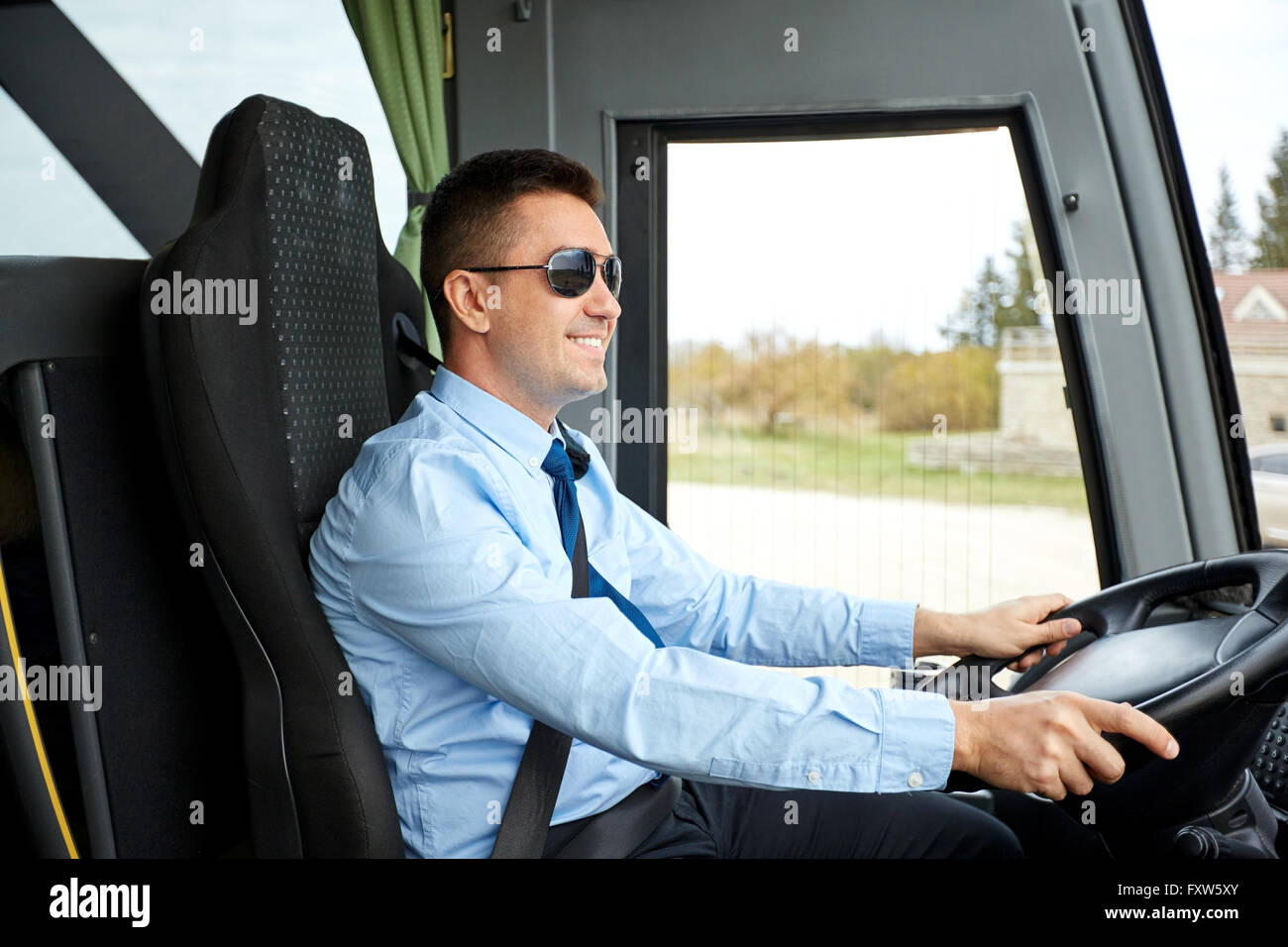 happy driver driving intercity bus Stock Photo - Alamy