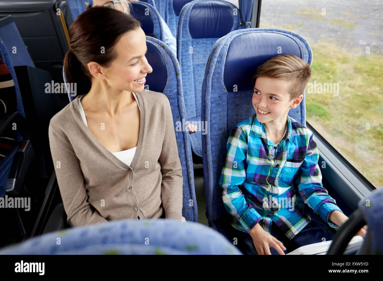happy family riding in travel bus Stock Photo - Alamy