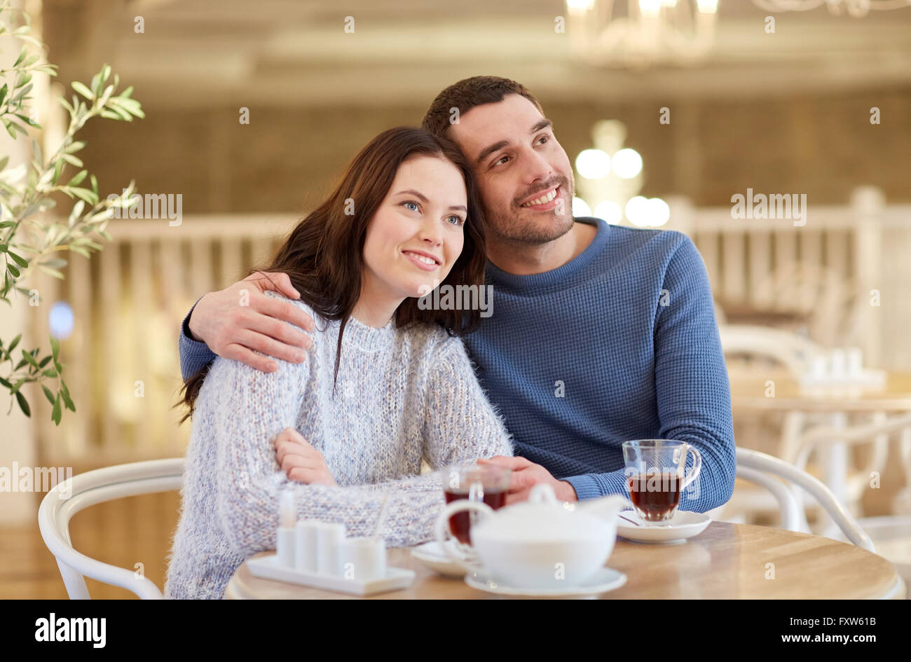 happy couple drinking tea at restaurant Stock Photo - Alamy