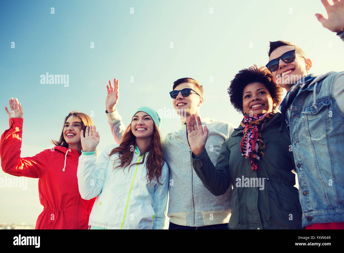 Waving hands to their friends hi-res stock photography and images - Alamy