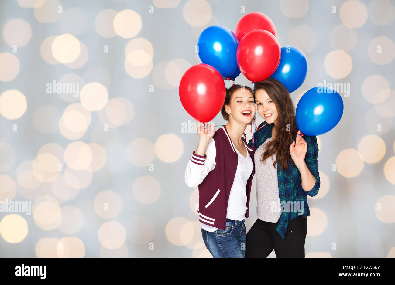happy teenage girls with helium balloons Stock Photo - Alamy