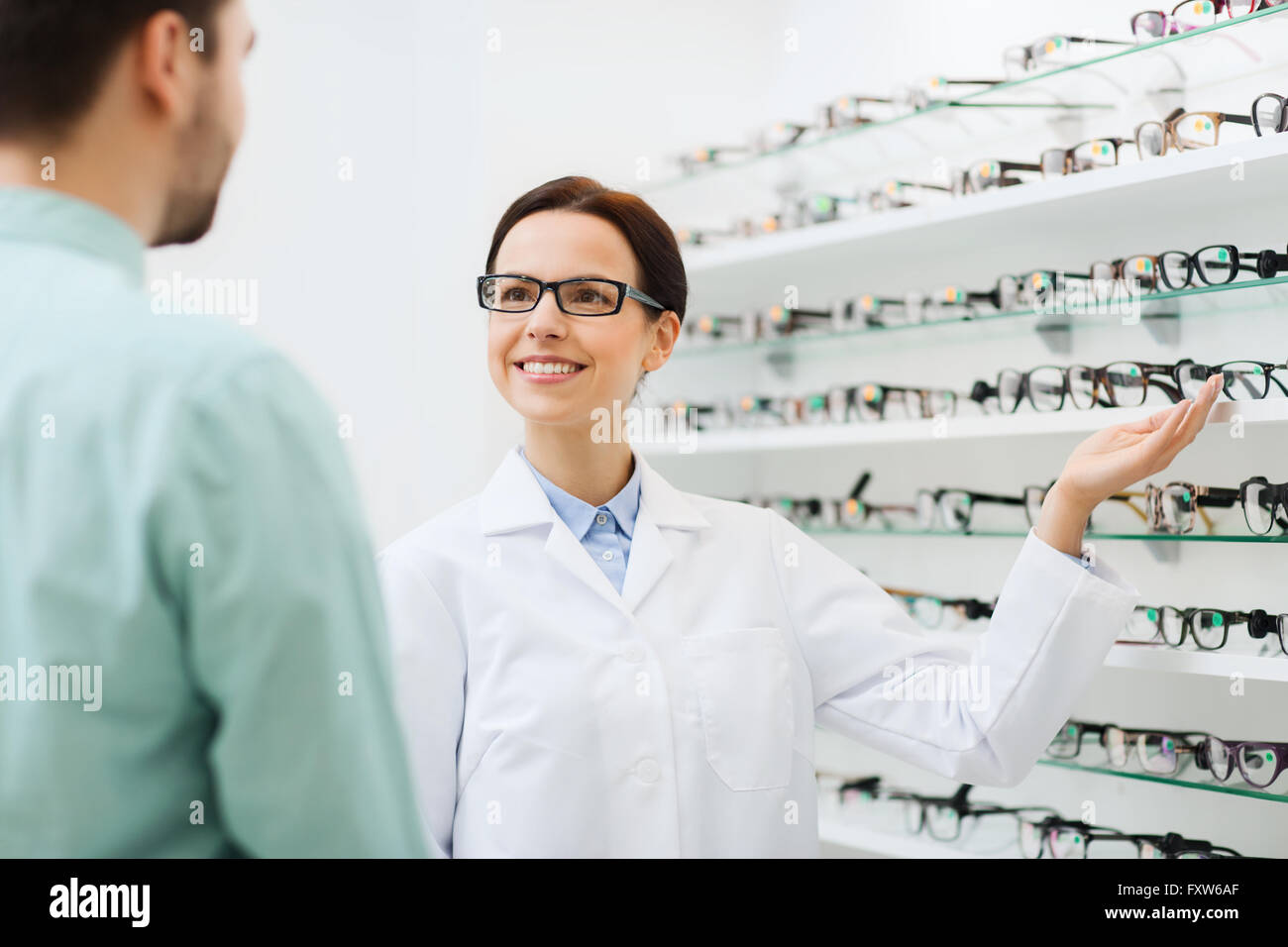 Optician showing glasses man hi-res stock photography and images - Alamy