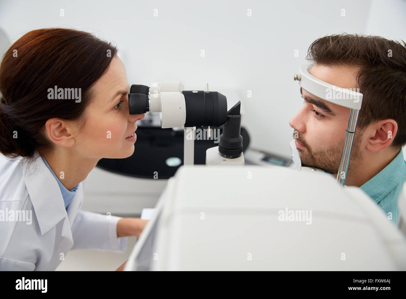 optician with tonometer and patient at eye clinic Stock Photo - Alamy