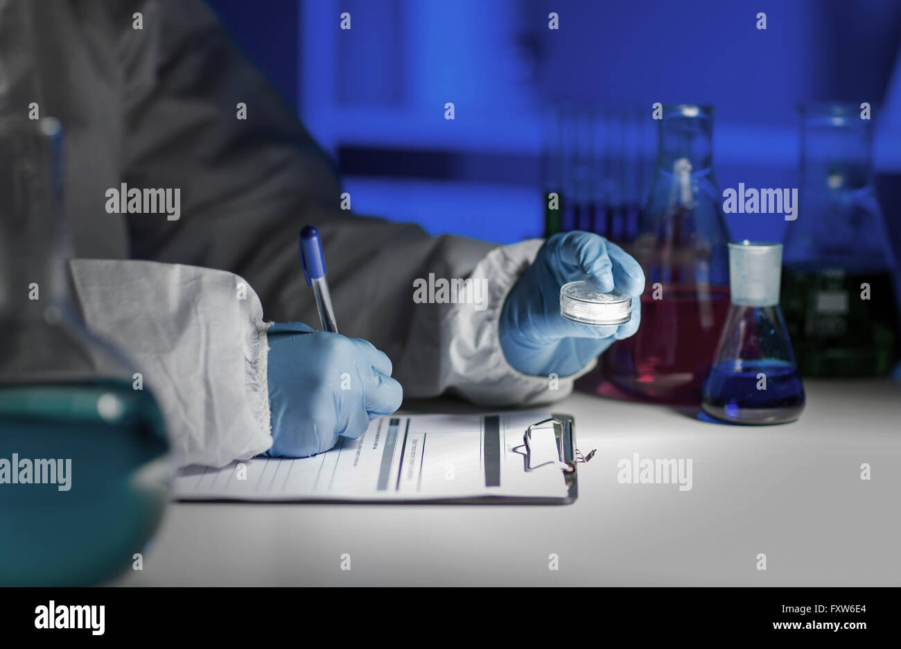 close up of scientist writing test results in lab Stock Photo - Alamy