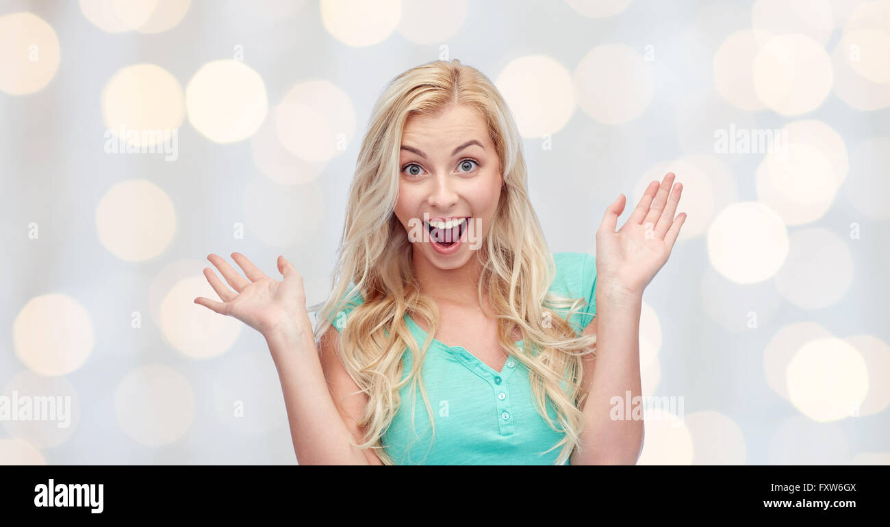 surprised smiling young woman or teenage girl Stock Photo - Alamy