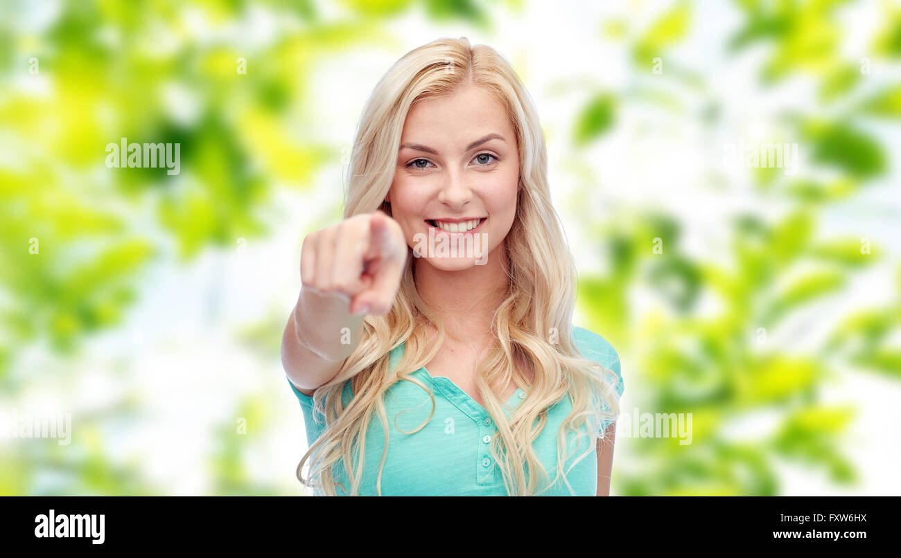 happy young woman pointing finger to you Stock Photo - Alamy
