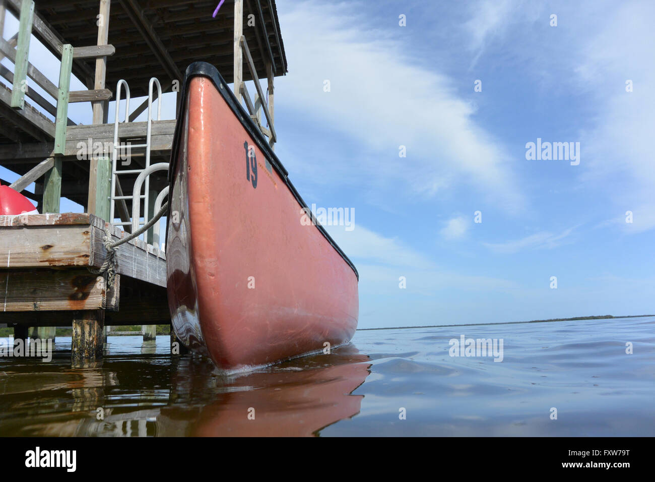Tethered canoe at a chickee that can only be reached by crossing ...