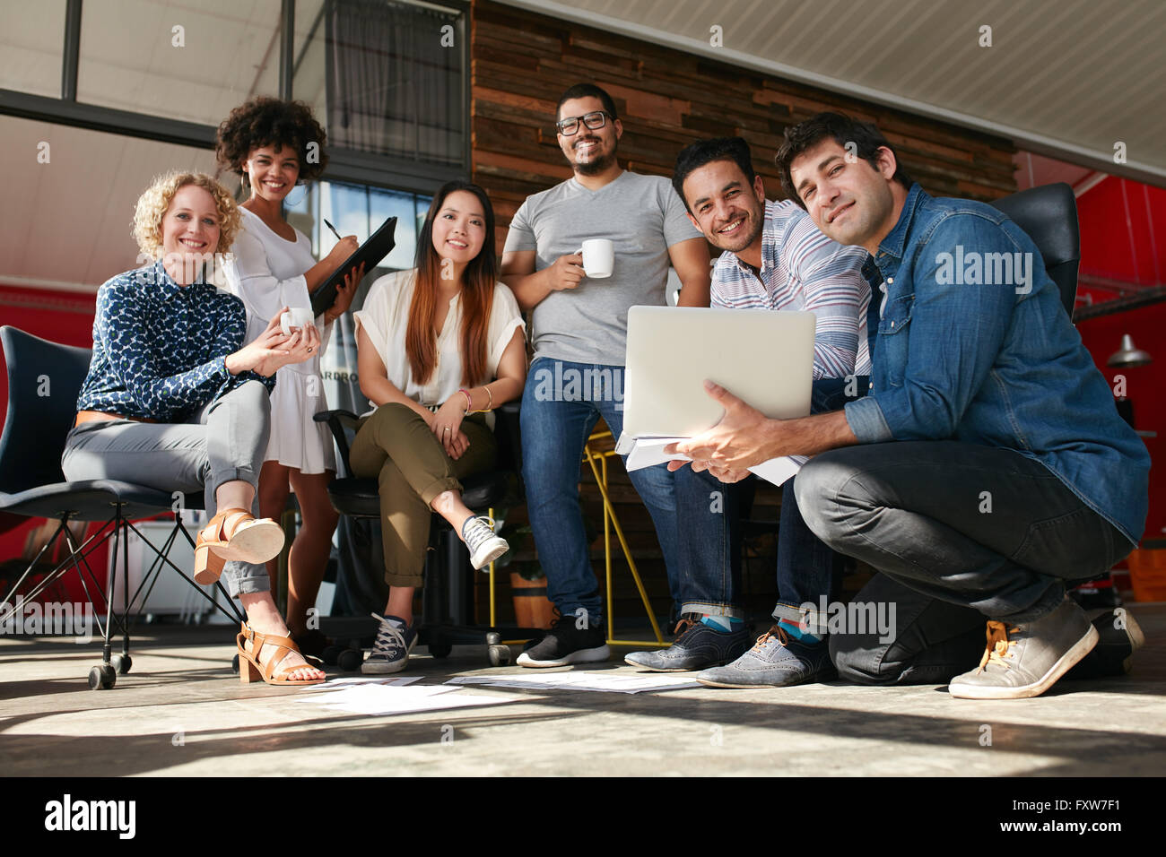 Team of creative professionals meeting in office. Multiracial group of ...