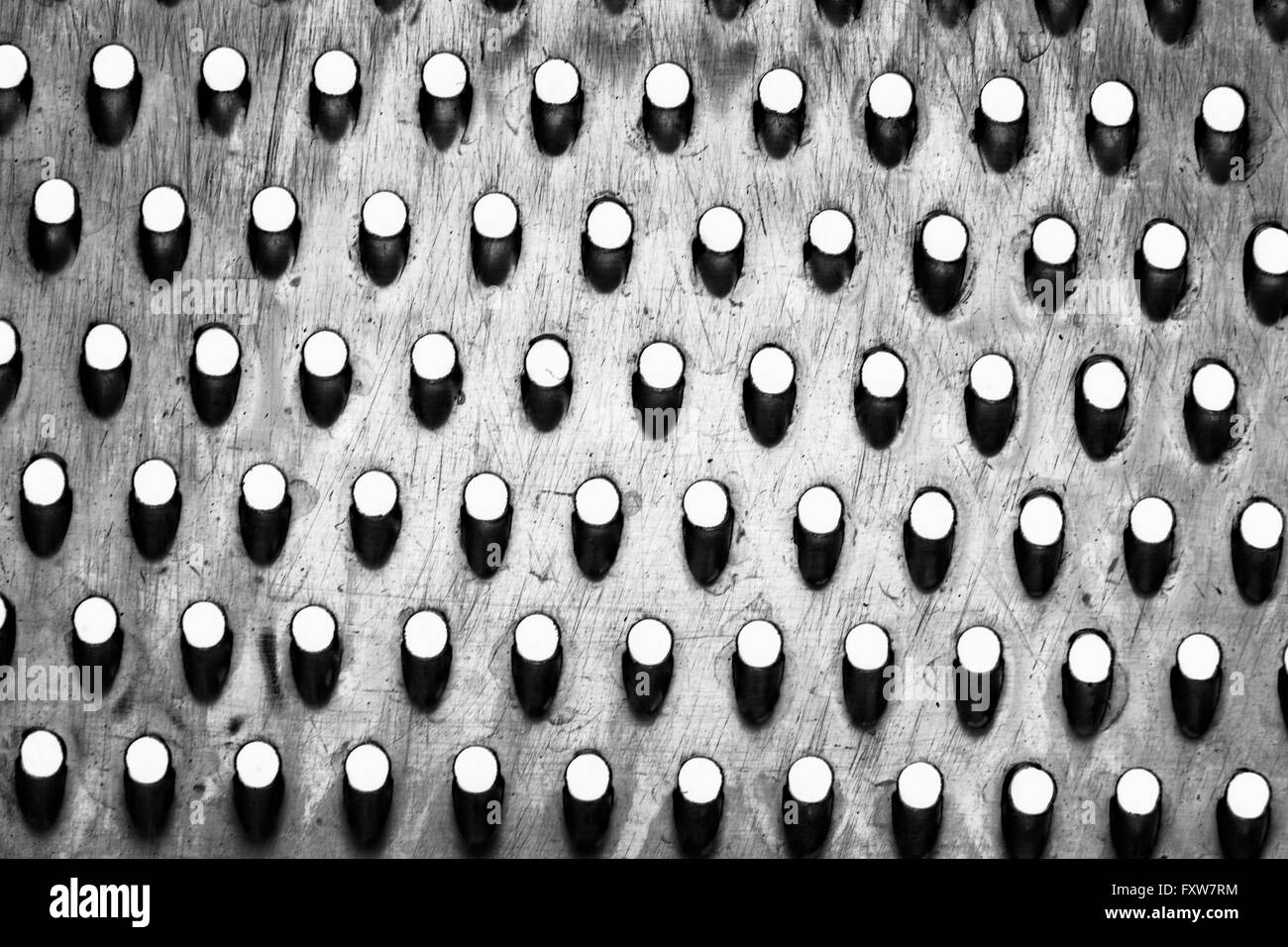 Background texture for a scratched cheese grater in black and white ...