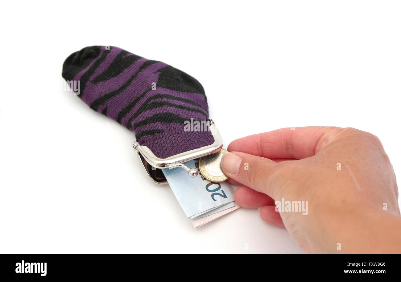 A woman puts money in a sock Stock Photo - Alamy