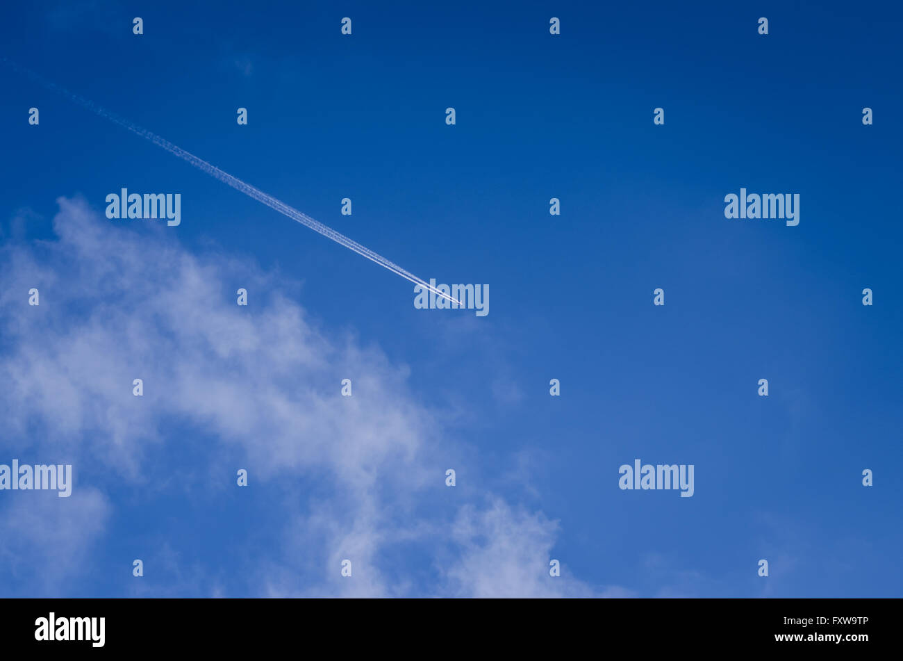 flying plane in the blue sky Stock Photo - Alamy