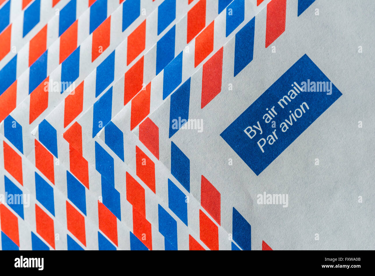 Distinct patterns of red, white and blue of stacked air mail envelopes ...