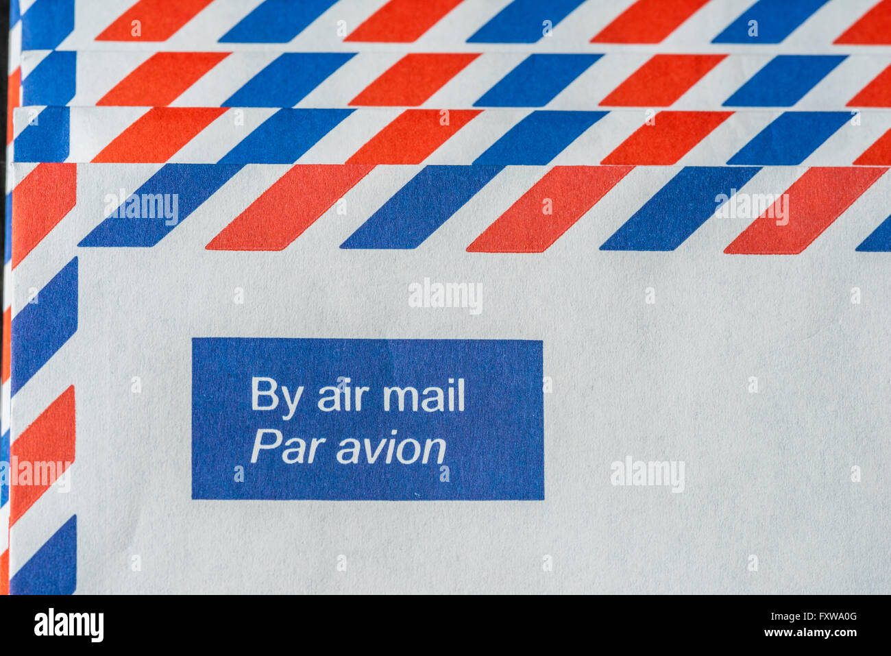 Distinct patterns of red, white and blue of stacked air mail envelopes ...