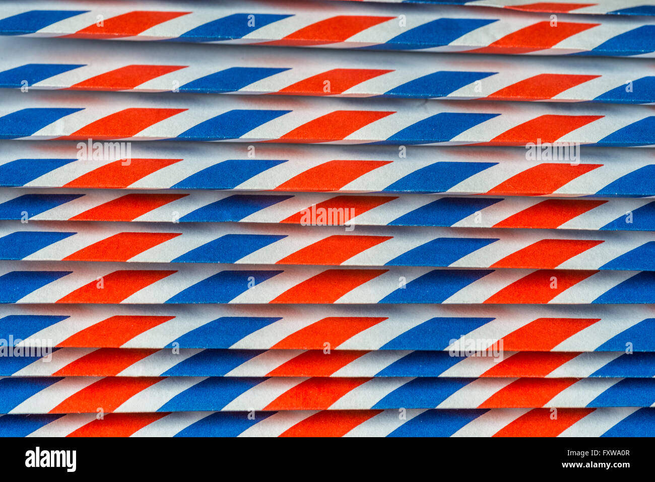 Distinct patterns of red, white and blue of stacked air mail envelopes ...