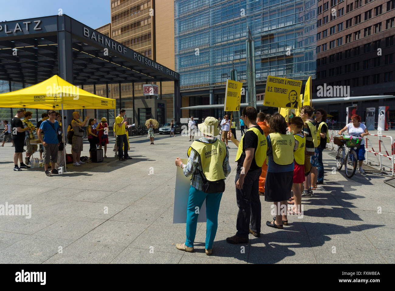 Amnesty International activists protest at Potsdamer Platz near the ...