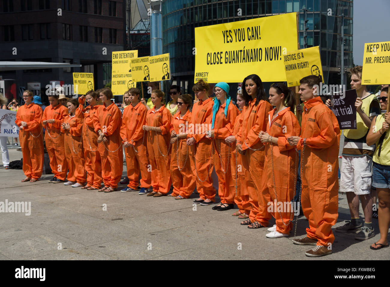 Amnesty International activists protest at Potsdamer Platz near the ...