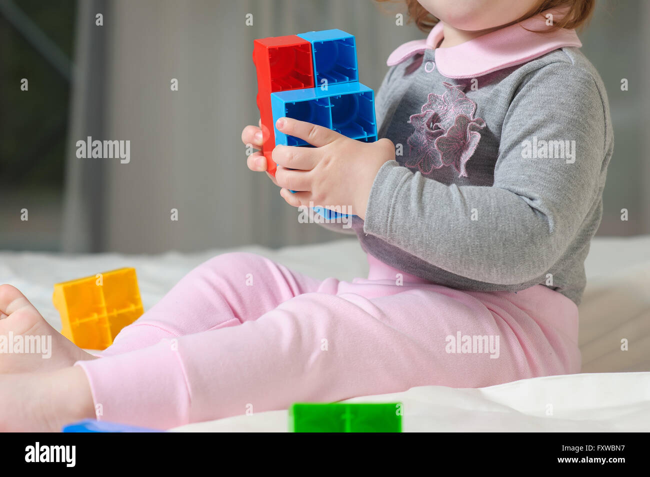 Cute baby playing Stock Photo - Alamy