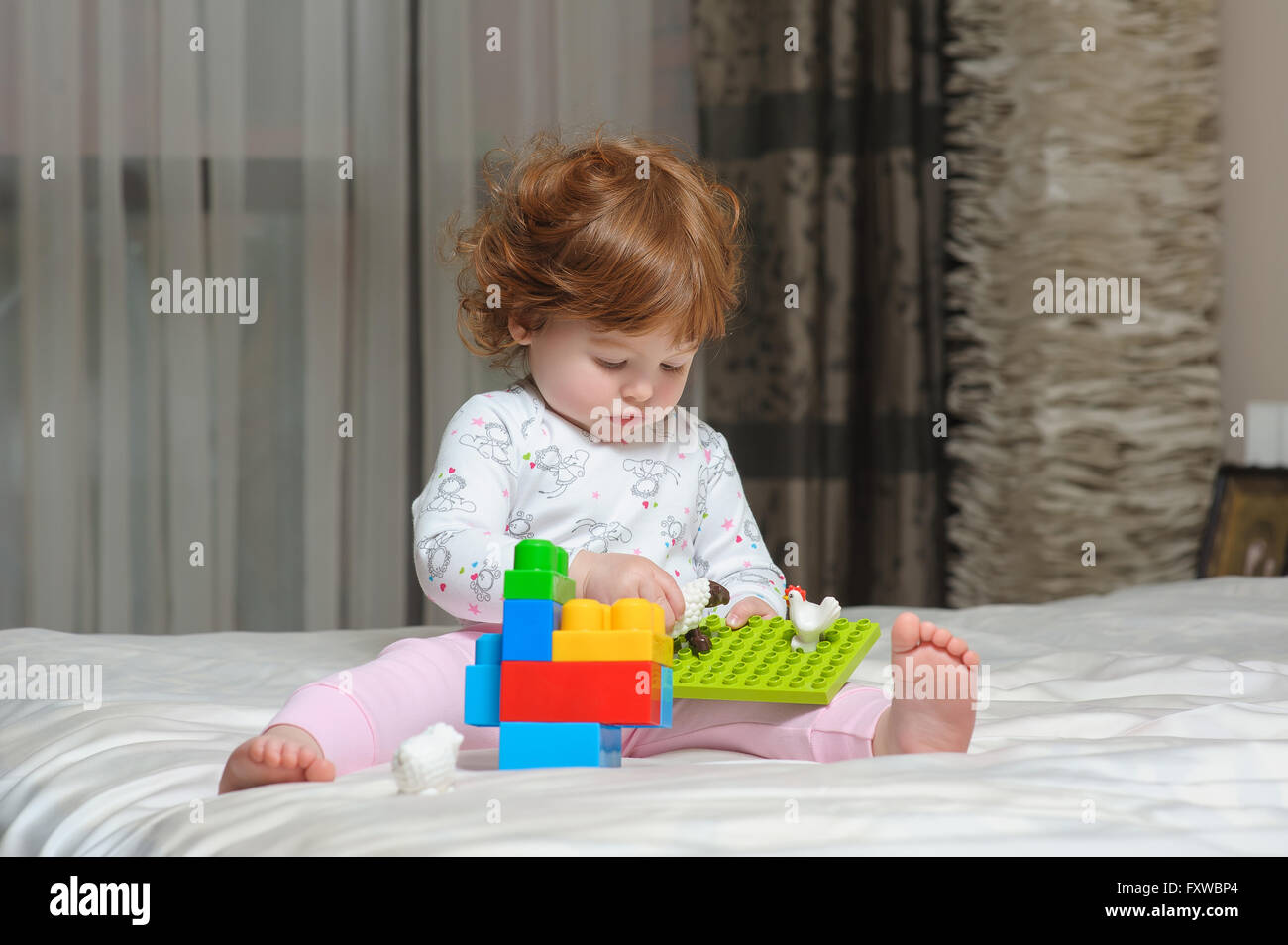 Cute baby playing Stock Photo - Alamy