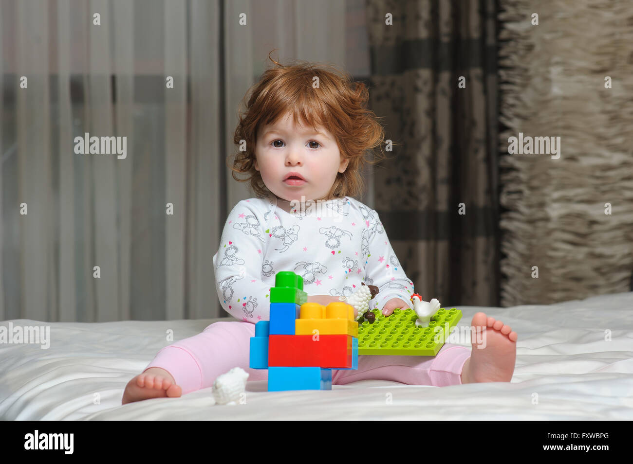 Cute baby playing Stock Photo - Alamy