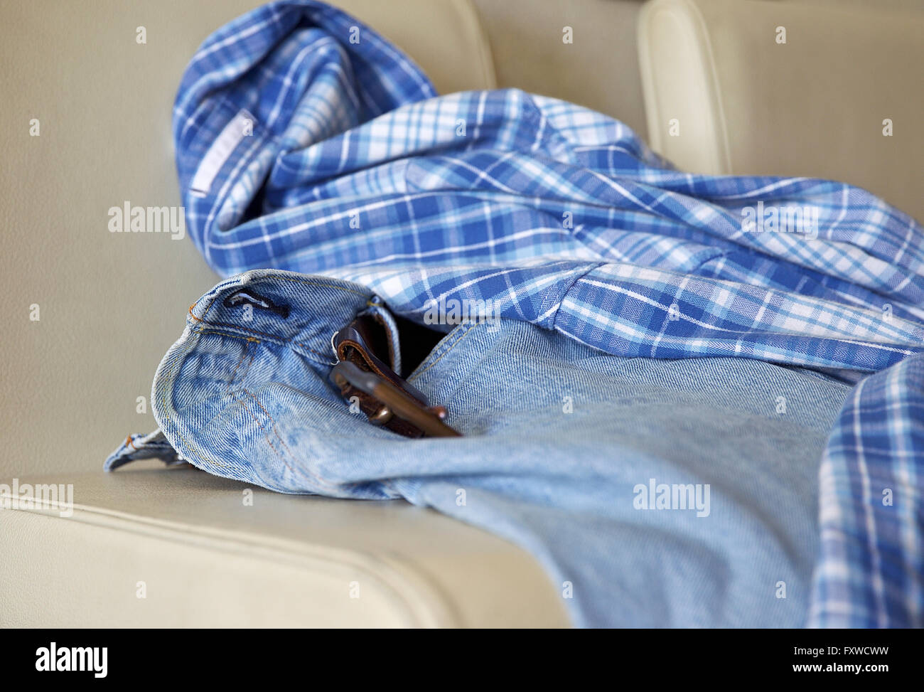 men's jeans and a shirt on a chair, clothes Stock Photo - Alamy