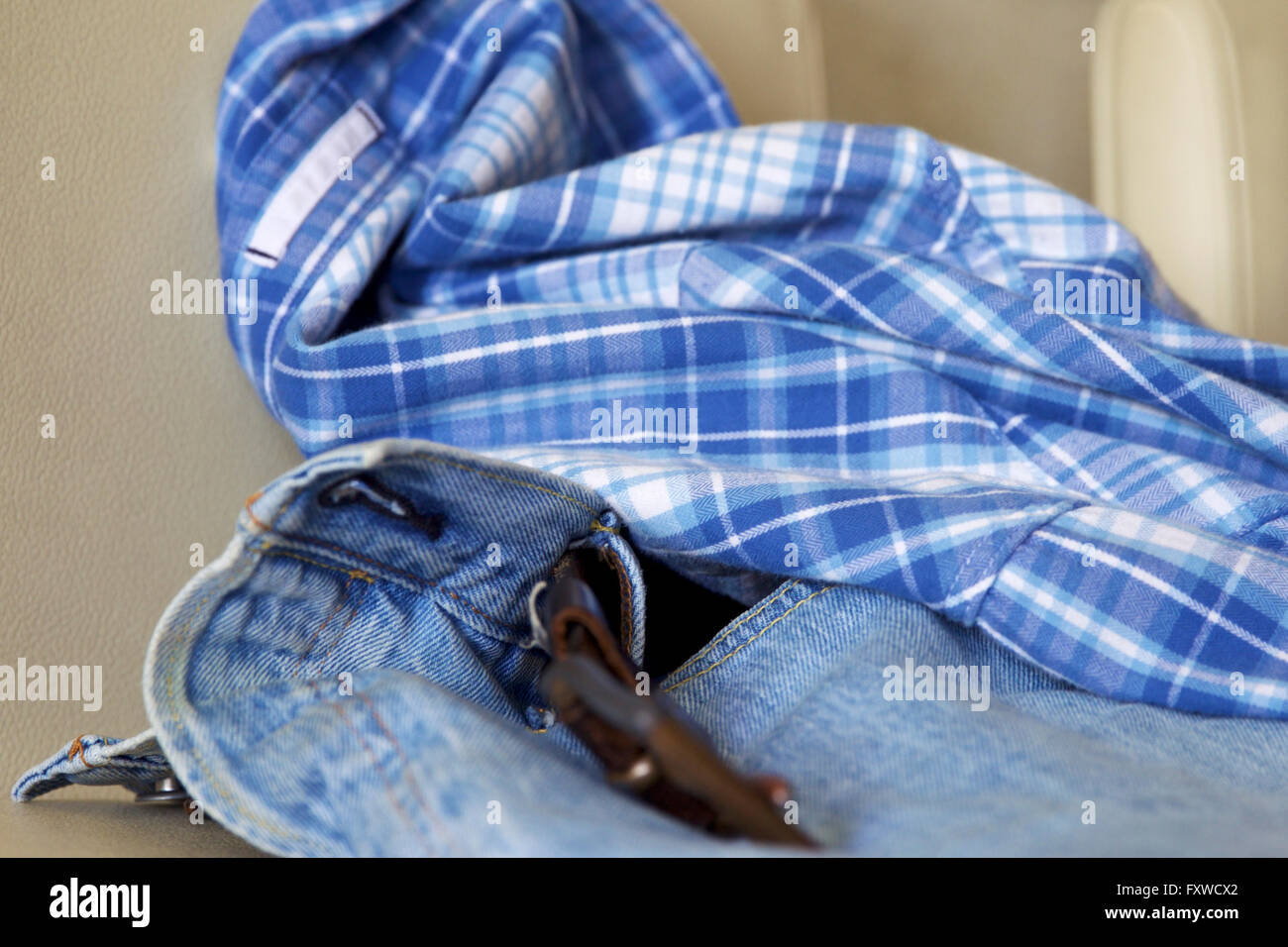 men's jeans and a shirt on a chair, clothes Stock Photo - Alamy