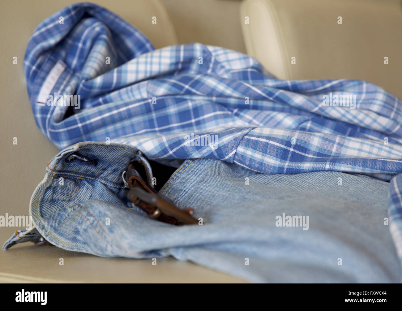 men's jeans and a shirt on a chair, clothes Stock Photo - Alamy