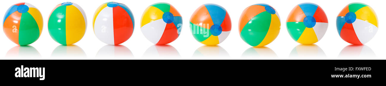 Colorful beach ball on reflective surface Stock Photo - Alamy