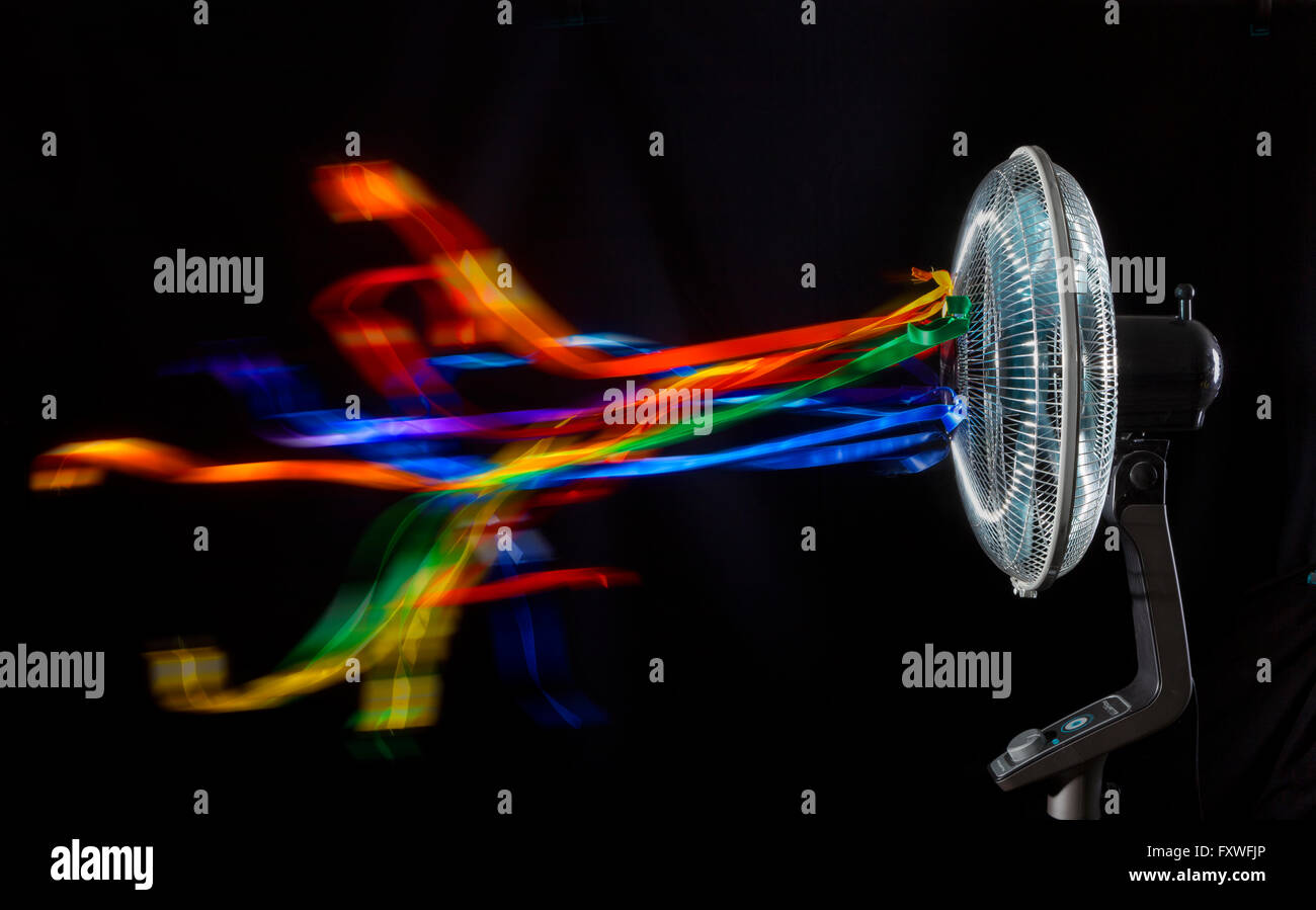 Photo graph of ribbons of the colours of the rainbow are blown by a ...