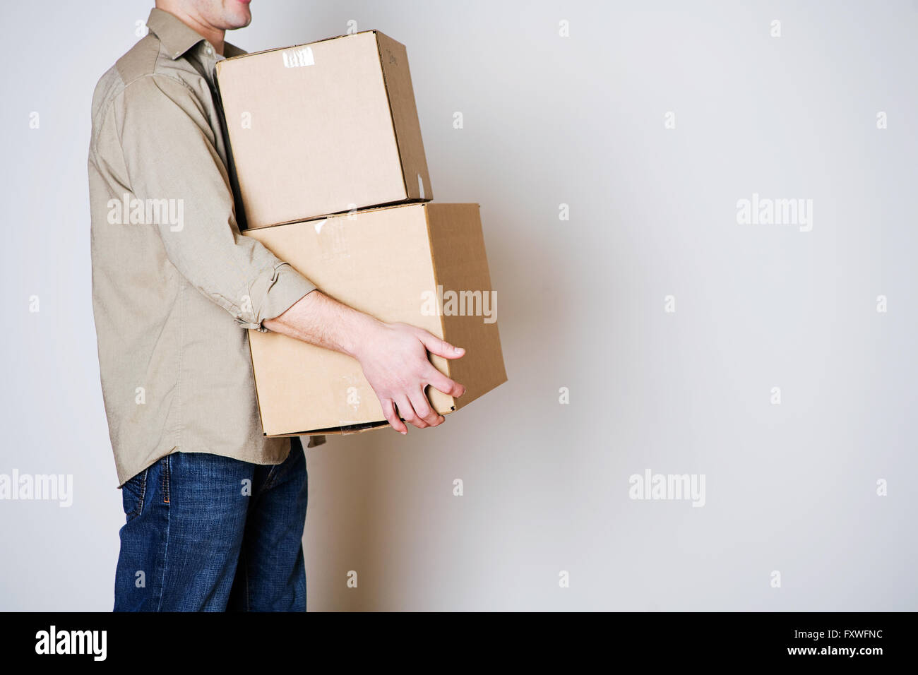 Young couple, indoors, packing posessions in cardboard boxes Stock ...