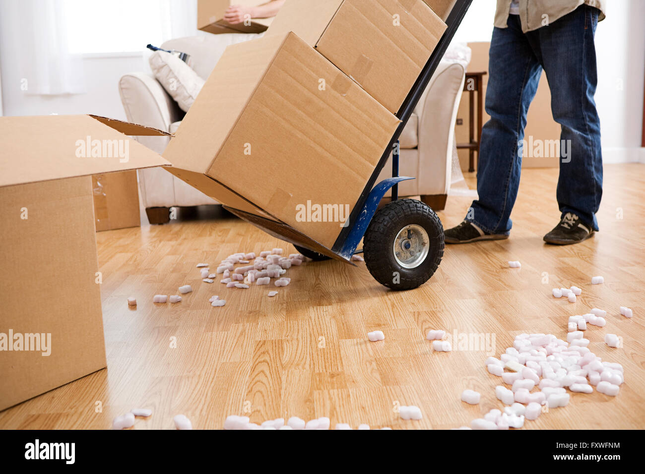 Young couple, indoors, packing posessions in cardboard boxes Stock ...