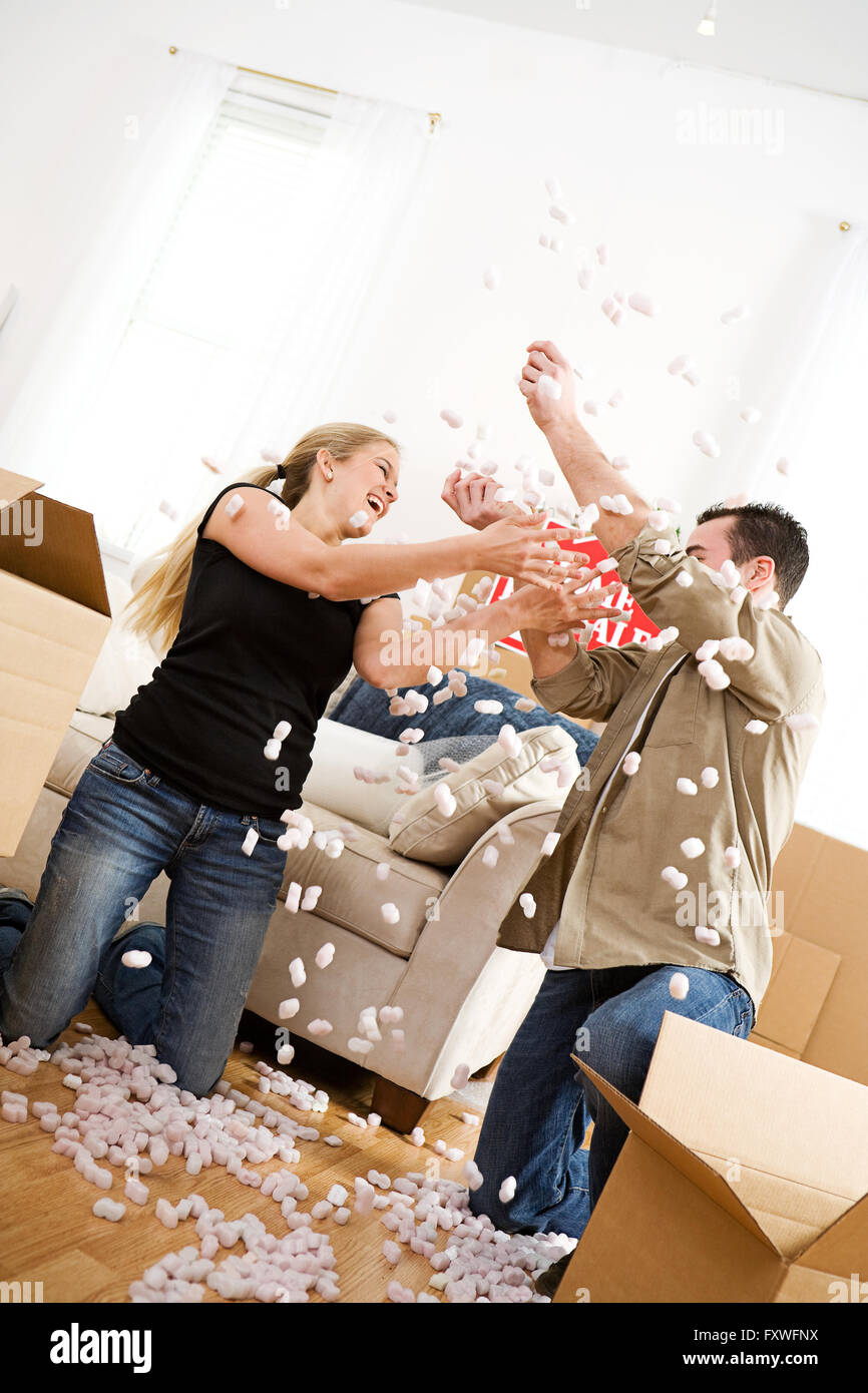 Young couple, indoors, packing posessions in cardboard boxes Stock ...