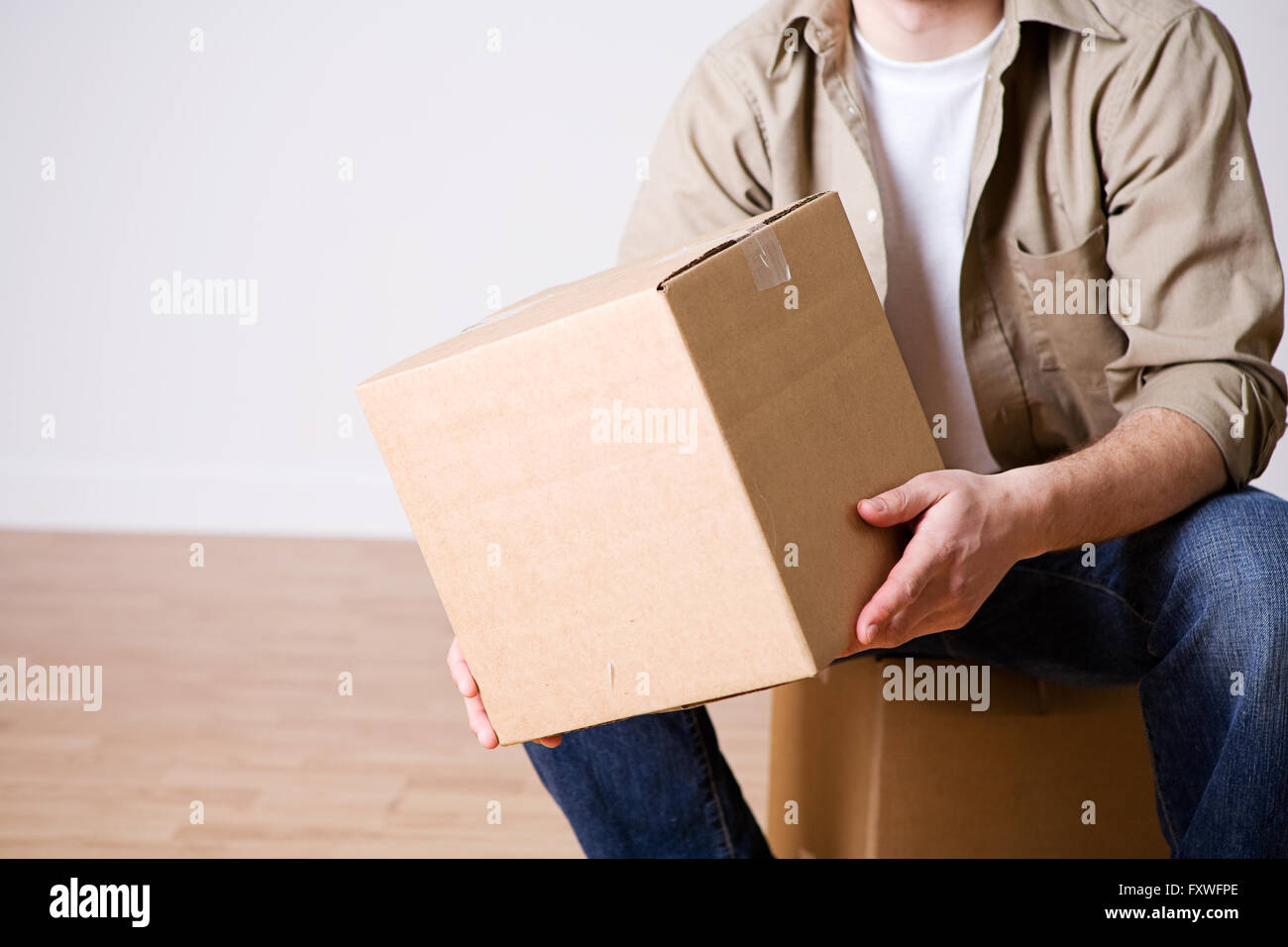 Young couple, indoors, packing posessions in cardboard boxes Stock ...