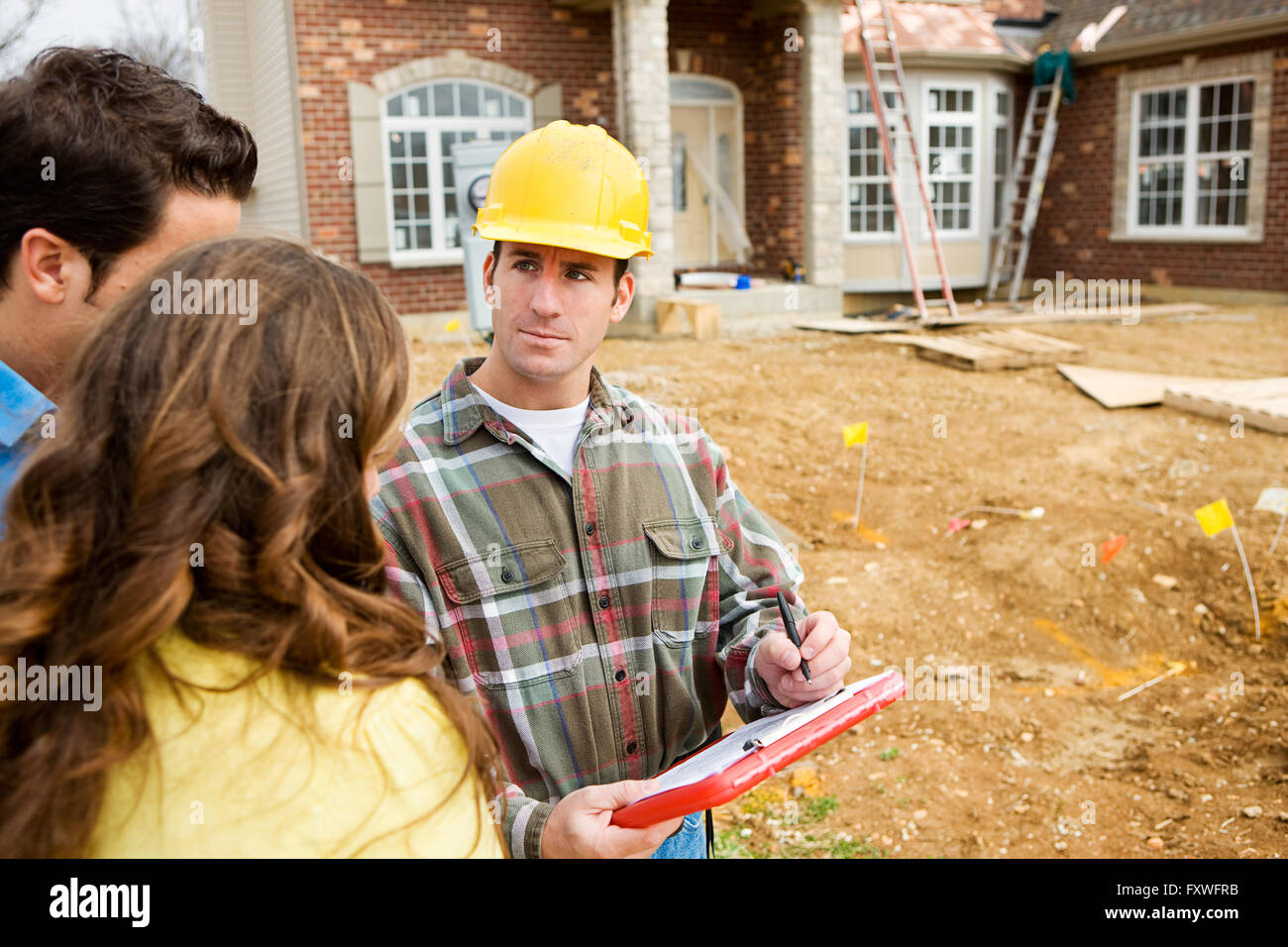 Series at a new home construction site. Includes construction worker ...